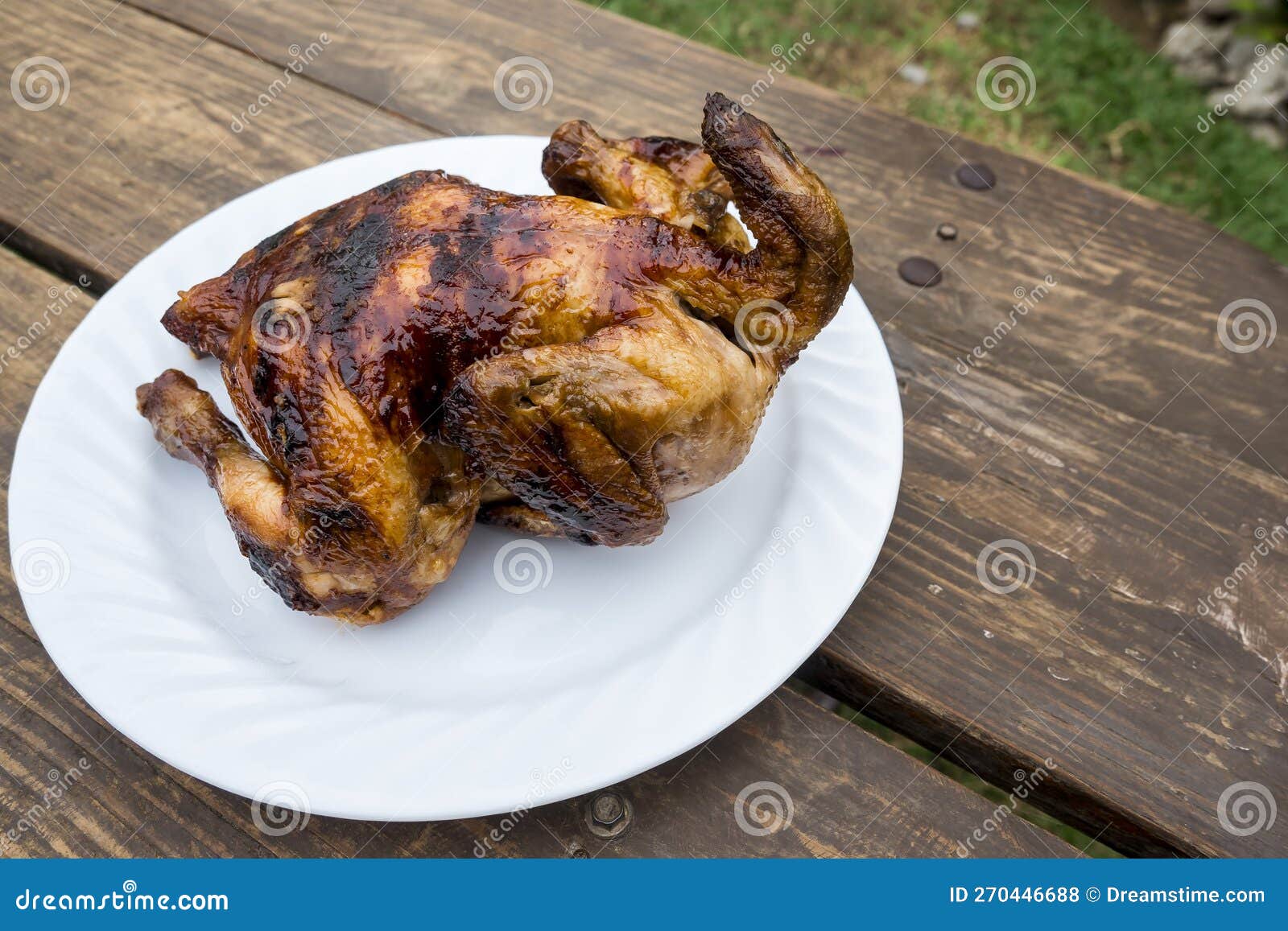 A Plate of Lechon Manok, or Roasted Chicken Served Outside at a Bench ...