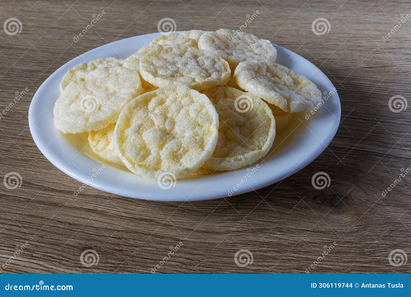 A Plate of Many Round Rice Chips with Cheese Flavor on the Table Stock ...