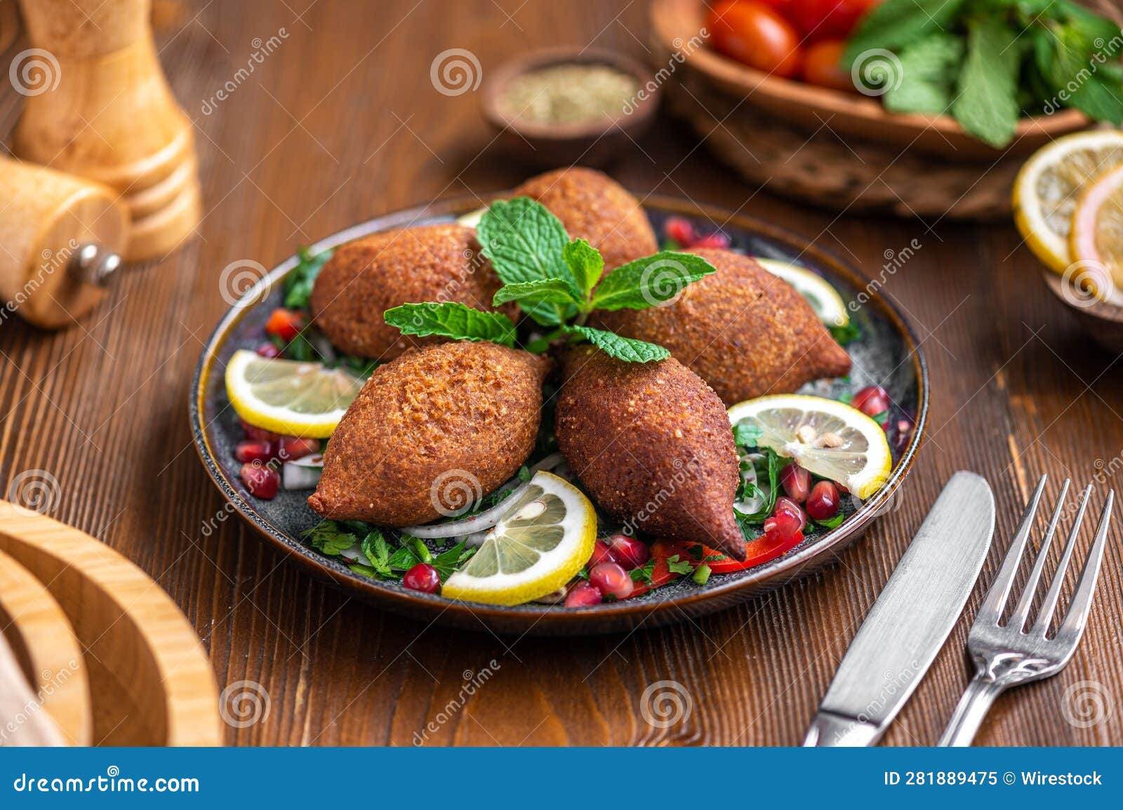 Plate of the Middle Eastern Dish, Kibbeh with Lemons Stock Image ...