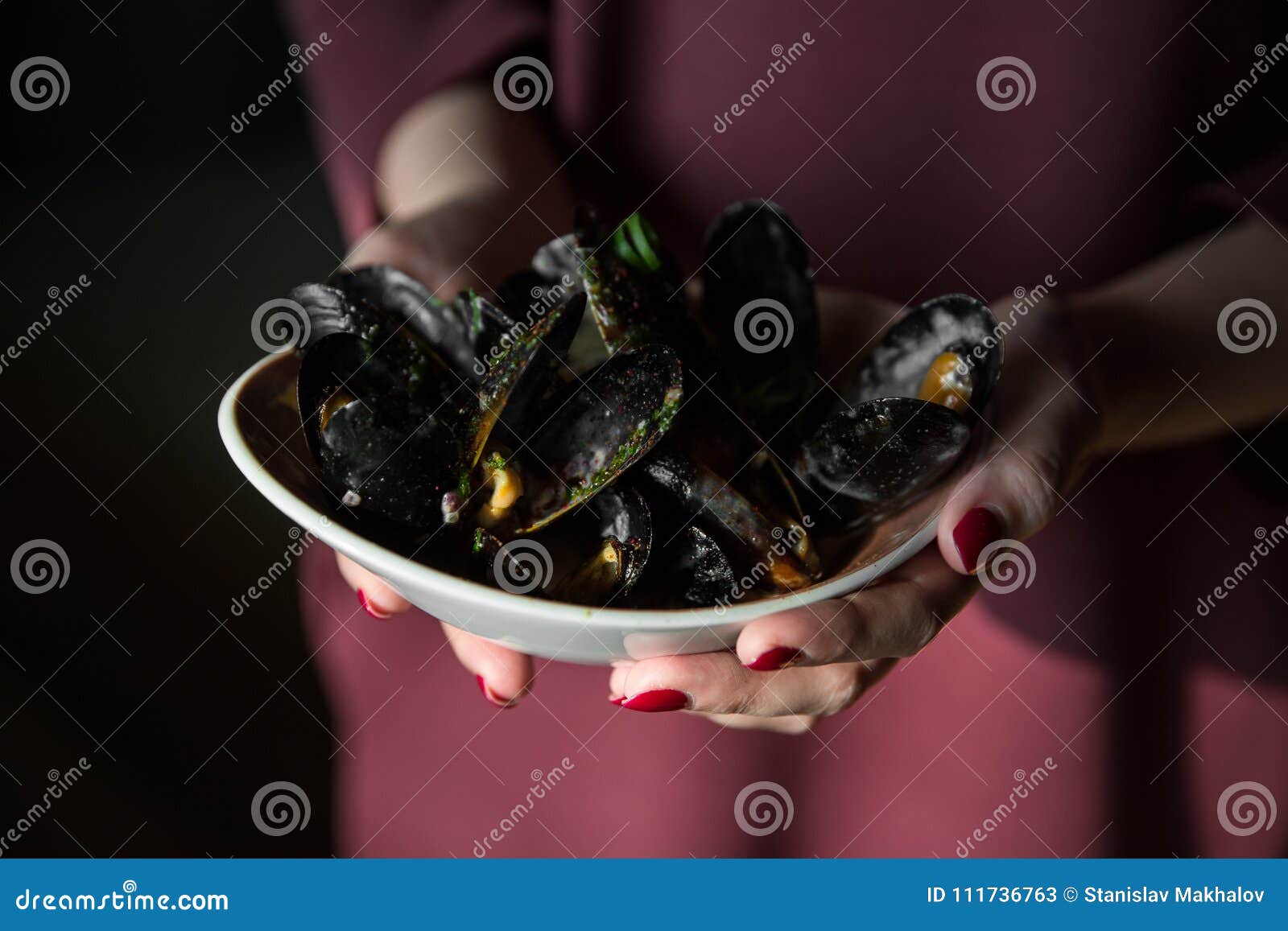 A Plate of Mussels in the Hands of a Female Stock Image - Image of ...
