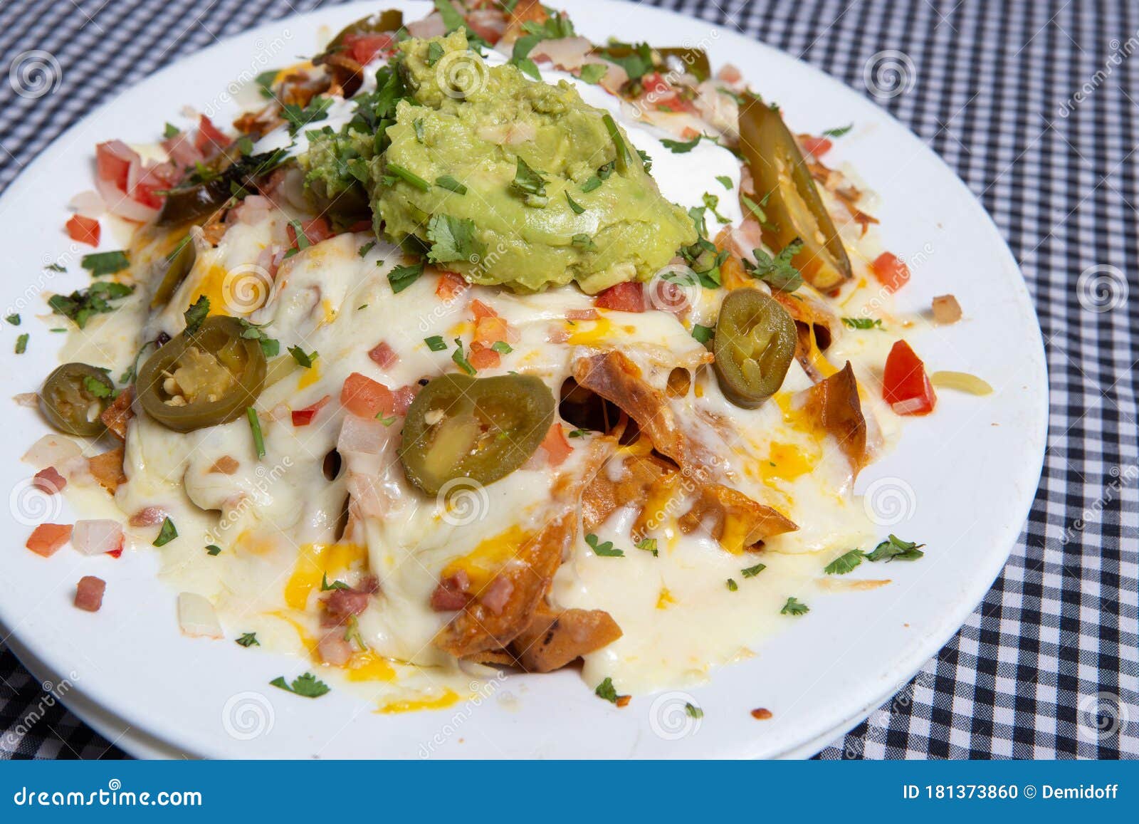 Plate of nachos stock photo. Image of lunch, isolated - 181373860