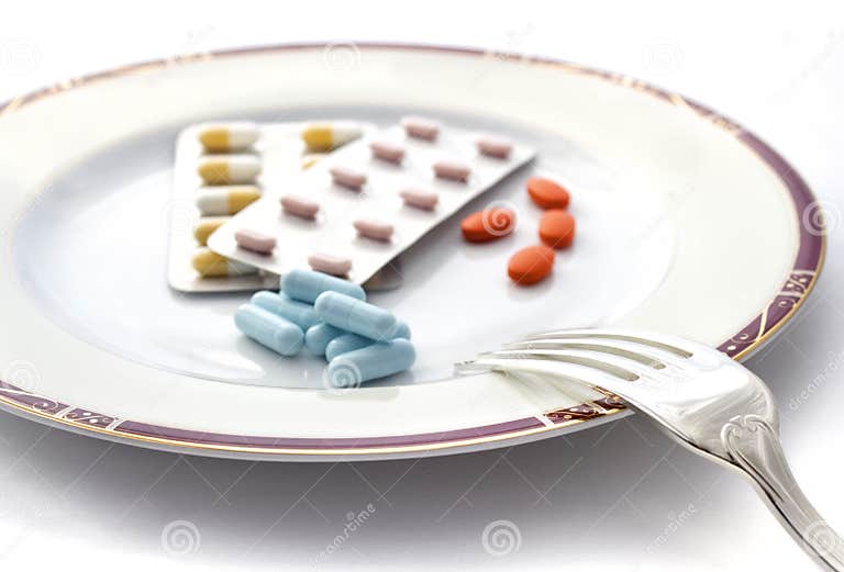 Plate ot pill with fork stock photo. Image of care, isolated - 18392952