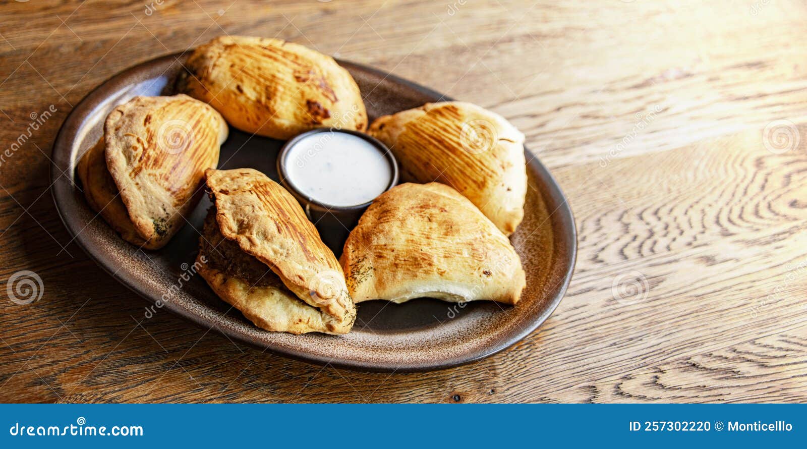 A Plate of Oven-baked Pierogi on a Restaurant Table Stock Photo - Image ...