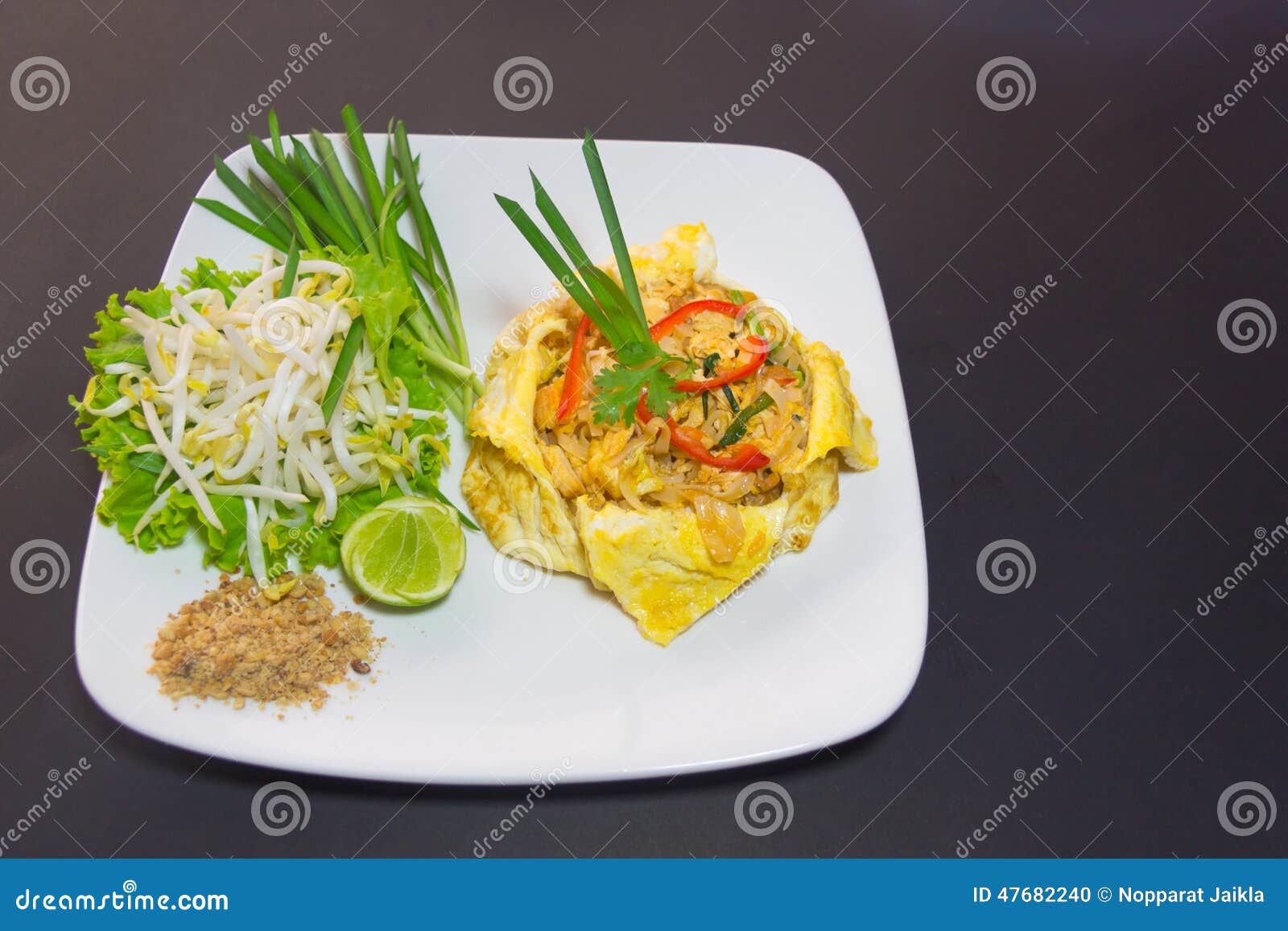 Plate of Pad Thai or Phat Thai in Omelette Stock Photo - Image of fried ...