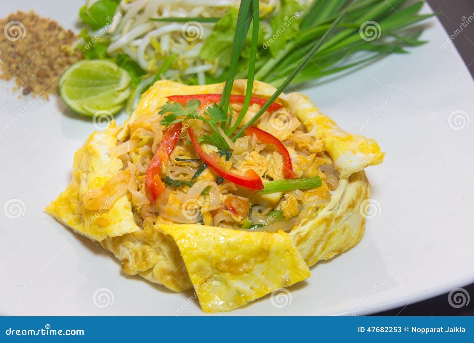 Plate of Pad Thai or Phat Thai in Omelette Stock Image - Image of ...