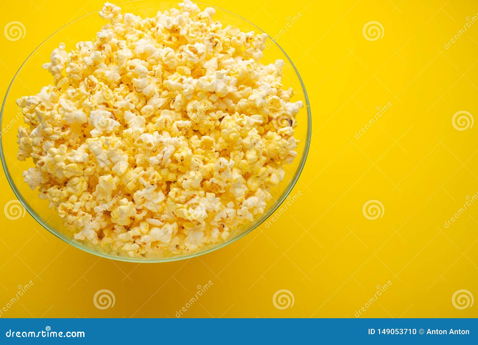 Plate with Popcorn on a Yellow Background. Layout. Top View Stock Photo ...
