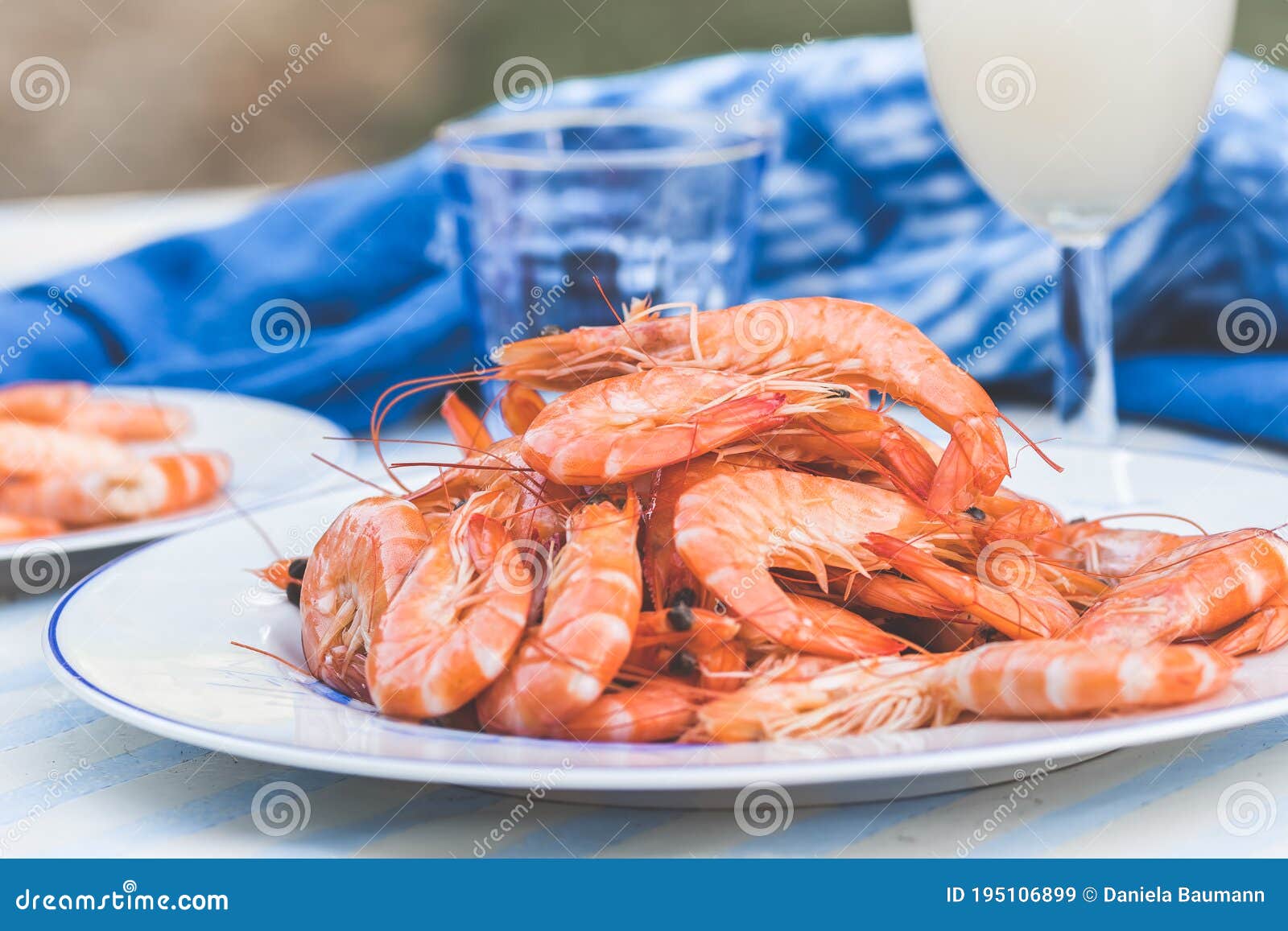 Plate with Prawns on a Blue and White Table Stock Image - Image of ...