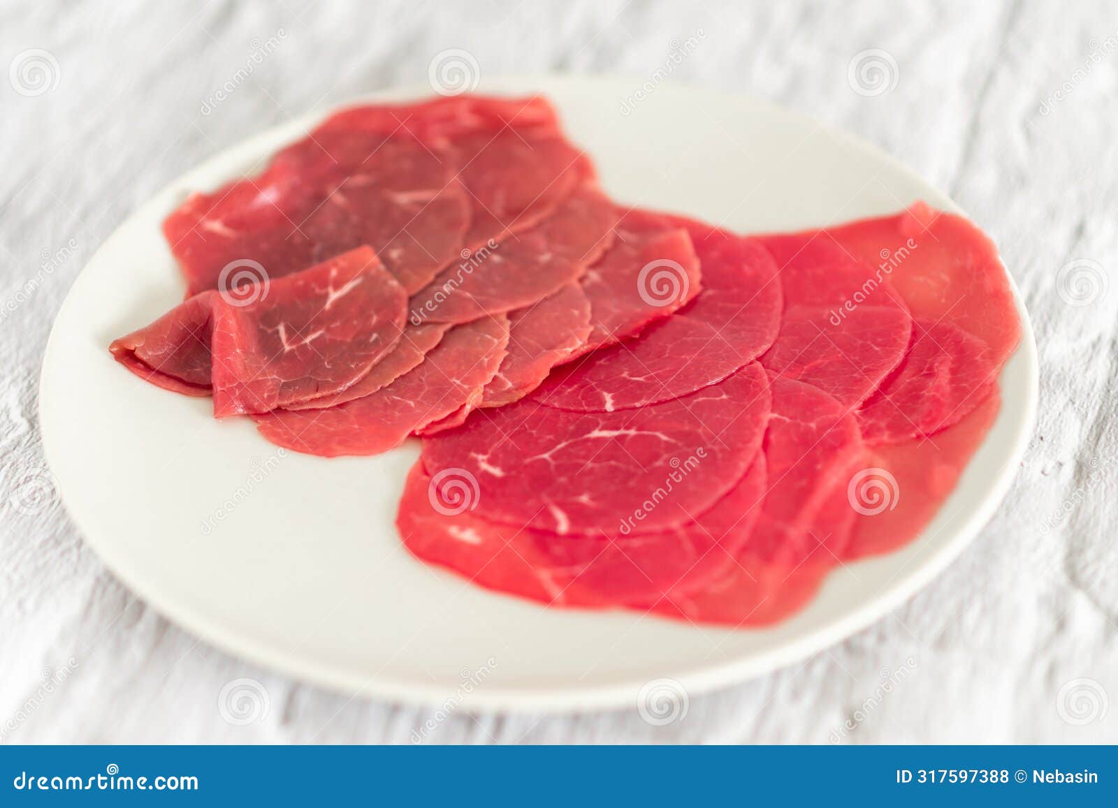 A Plate of Red Meat with a White Background Stock Photo - Image of beef ...