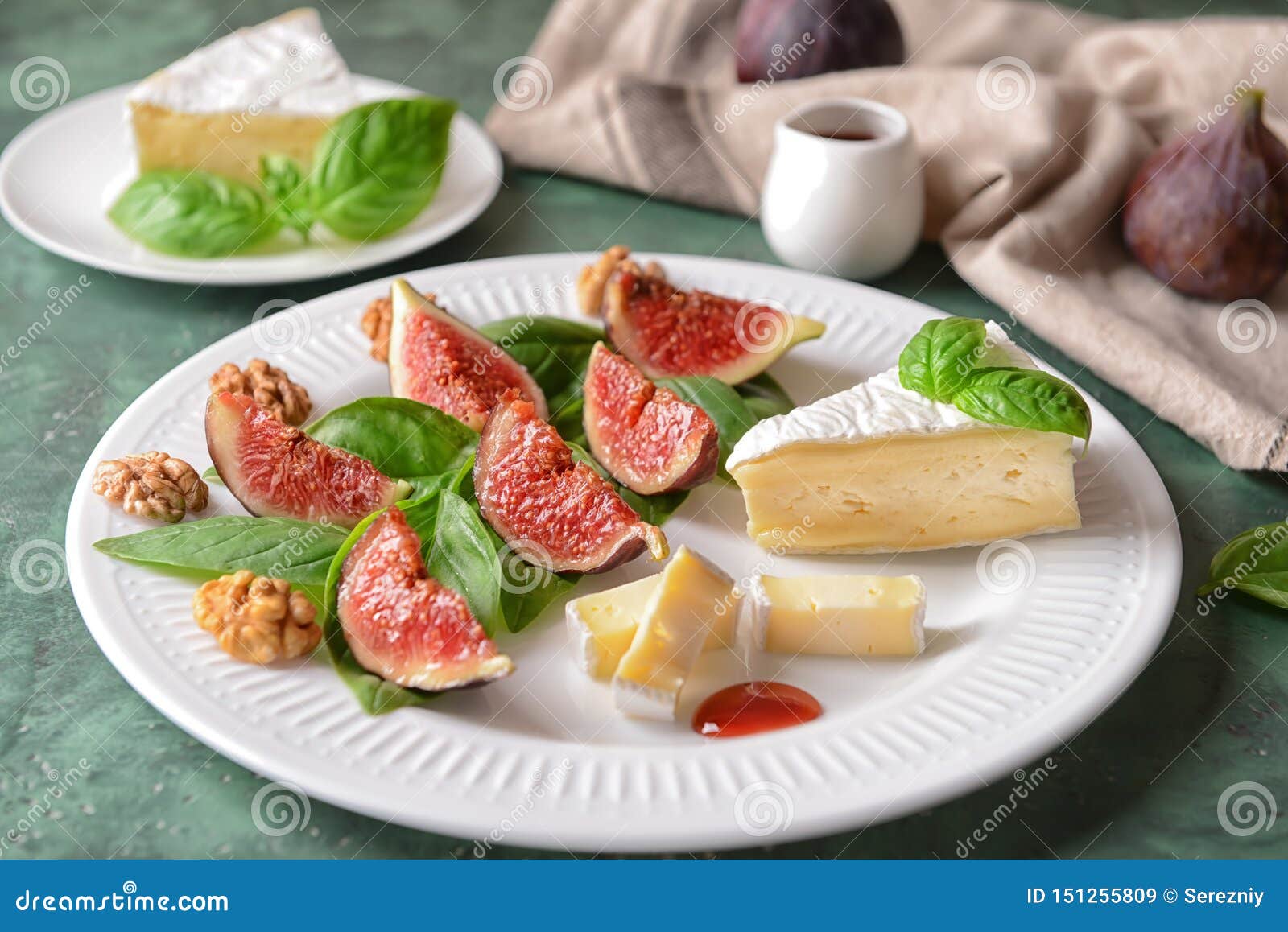 Plate with Ripe Figs and Cheese on Color Table Stock Image - Image of ...
