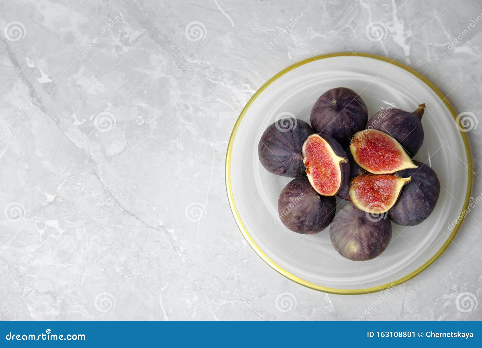 Plate with Ripe Figs on Light Grey Marble Table, Top View. Space for ...