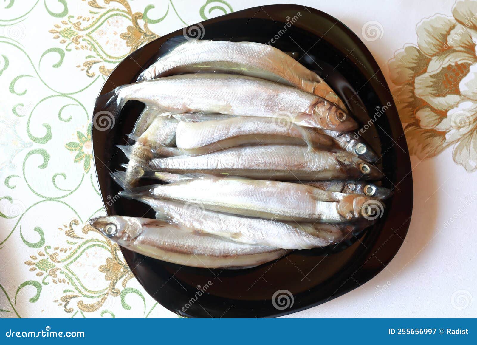 Plate with salted capelin stock image. Image of natural - 255656997