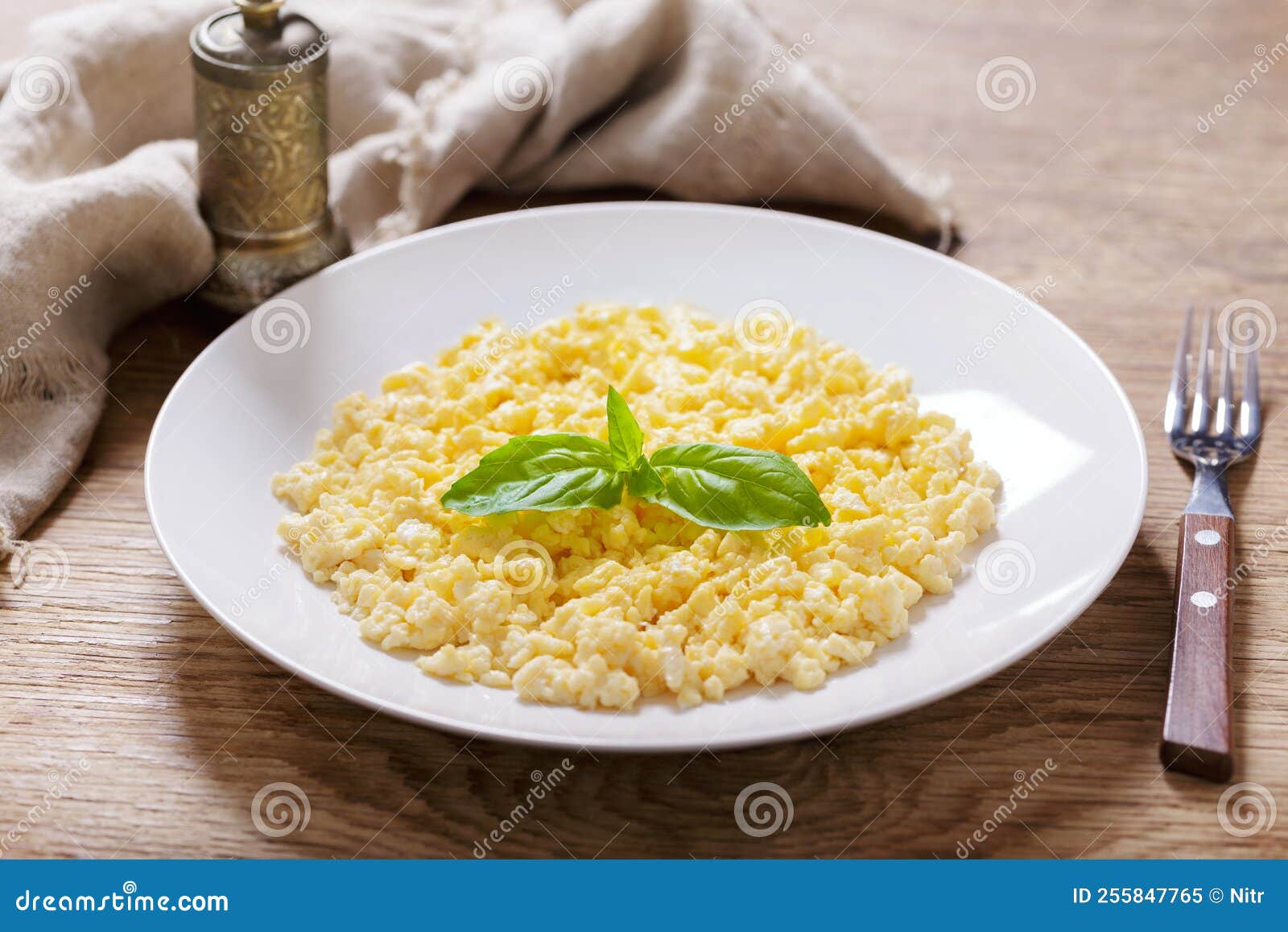 Plate of scrambled eggs stock image. Image of table - 255847765