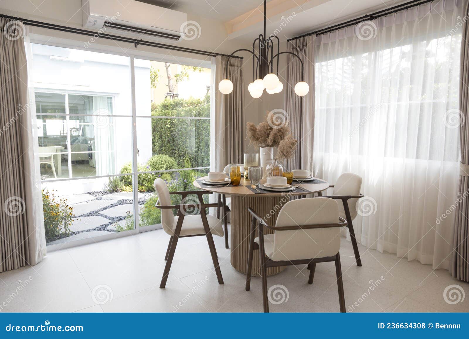 Plate Setting on Round Table in Modern Style Dining Room Interior of ...