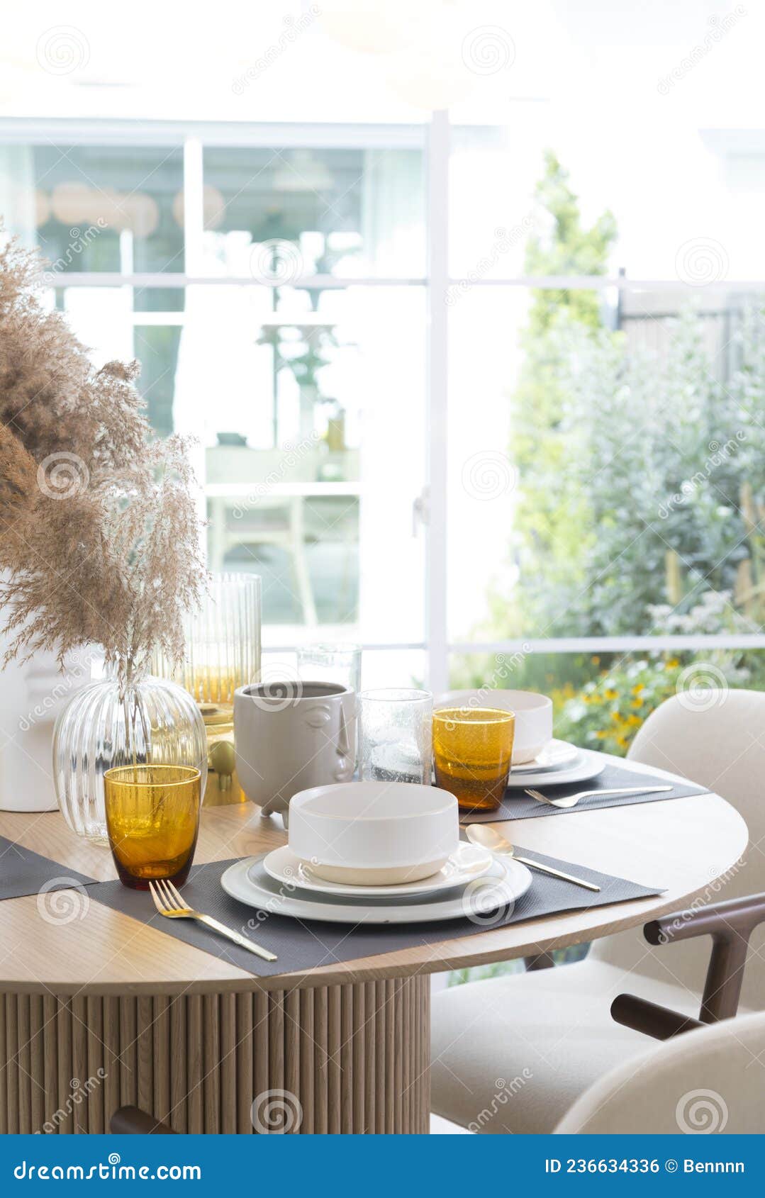 Plate Setting on Round Table in Modern Style Dining Room Interior of ...