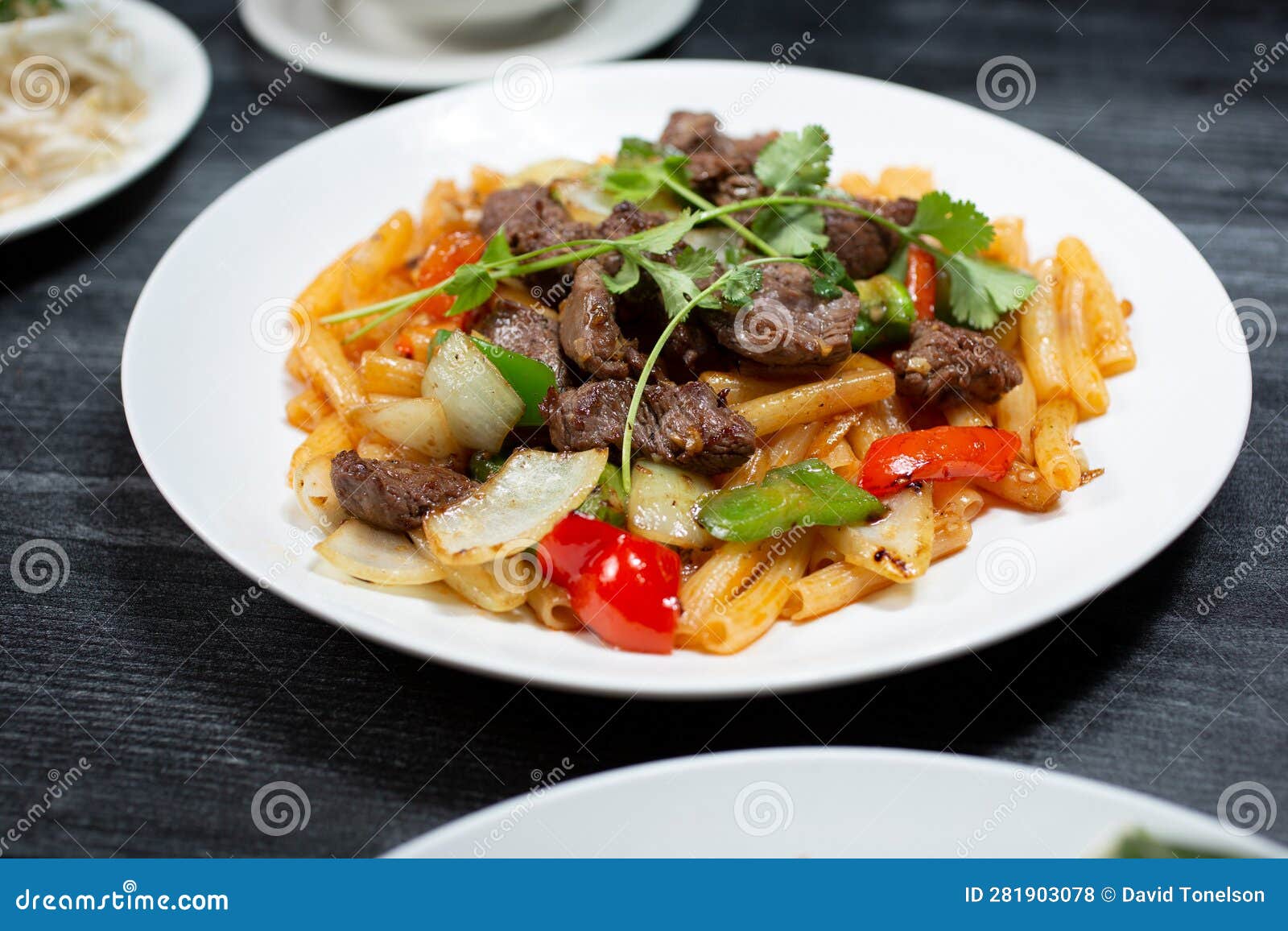Plate of shaking beef stock photo. Image of cilantro - 281903078