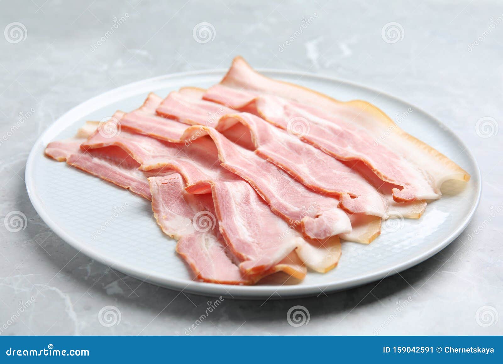 Plate of Sliced Raw Bacon on Grey Marble Table Stock Image - Image of ...