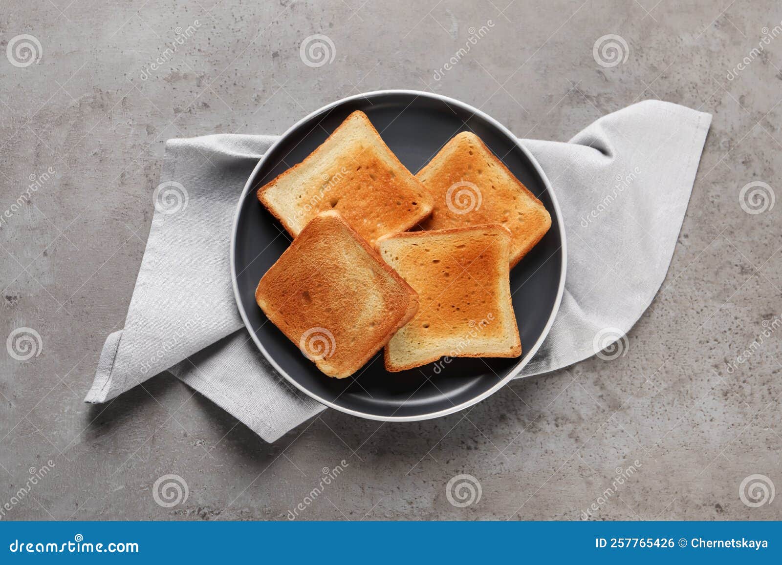 Plate with Slices of Delicious Toasted Bread on Gray Table, Top View ...