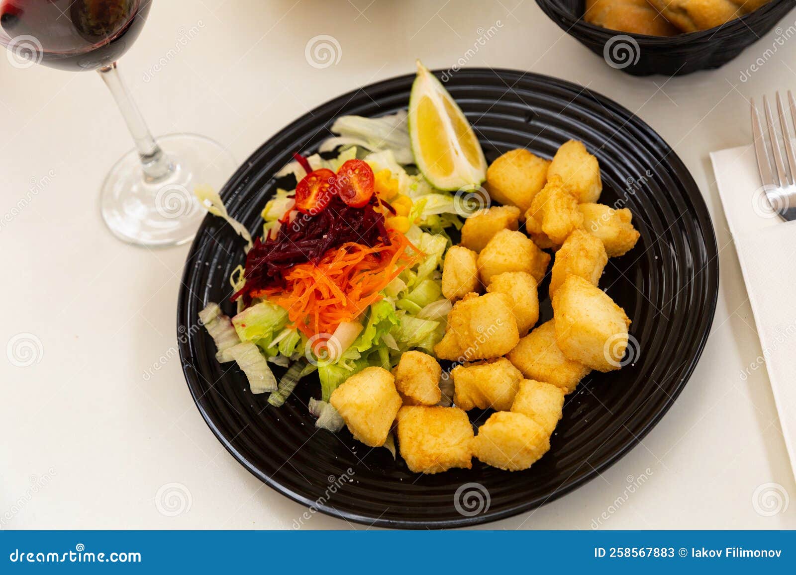 Plate with Slices of Fried Cuttlefish Breaded with Lemon Stock Image ...