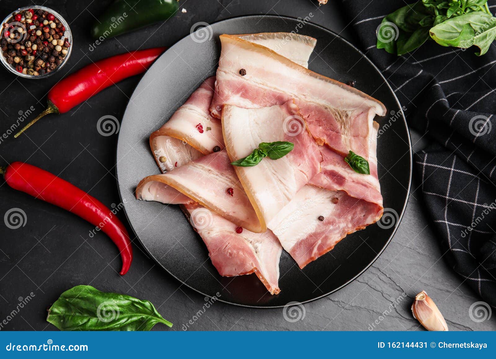 Plate with Slices of Raw Bacon on Dark Table Stock Image - Image of ...