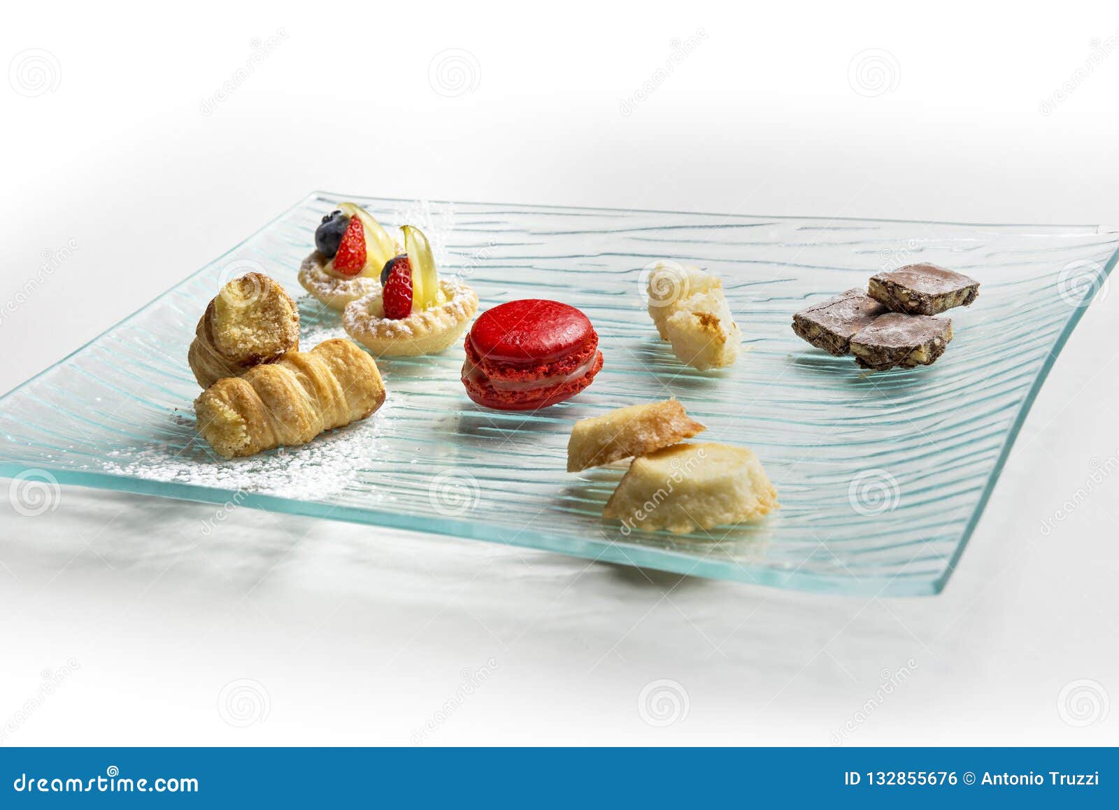 Plate with small pastry stock photo. Image of party - 132855676