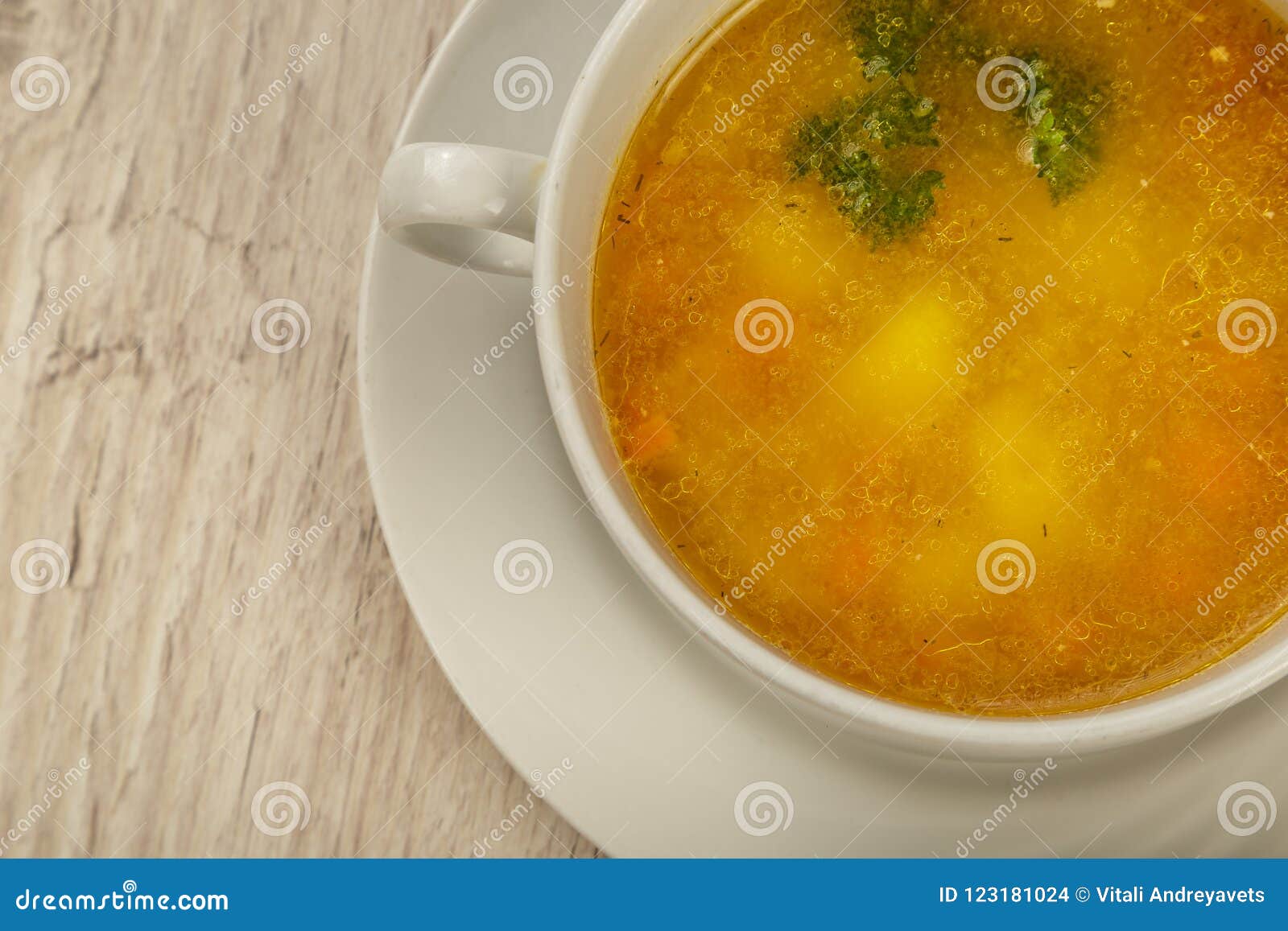 Plate with Soup in a White Plate on a Wooden Background. Stock Photo ...