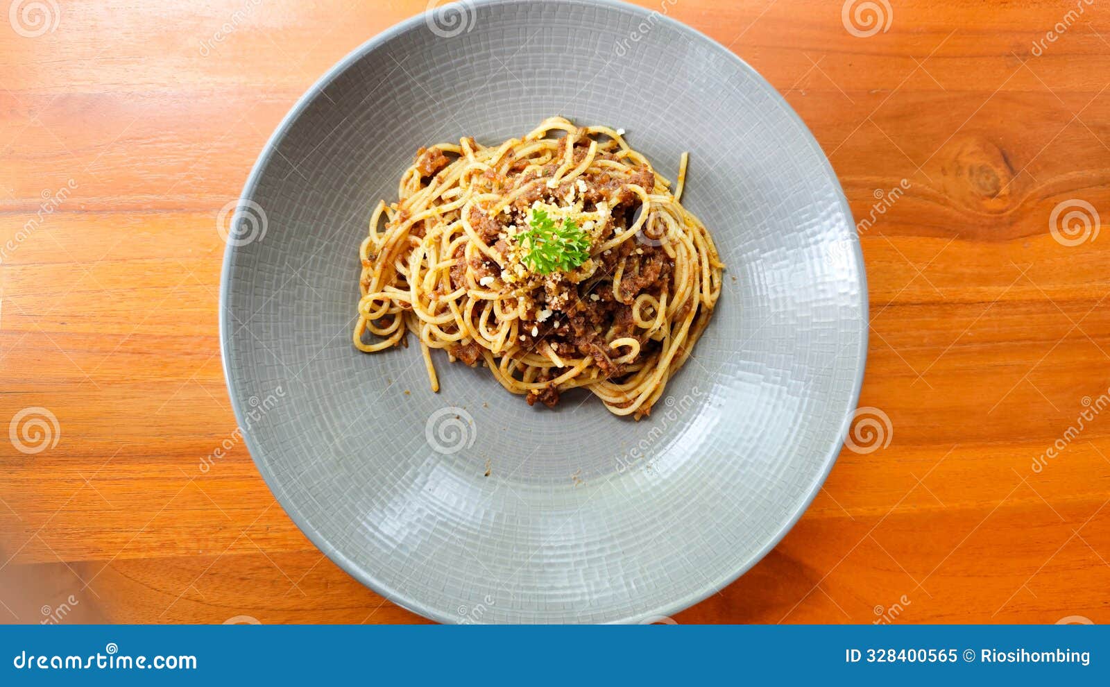 Plate of Spaghetti Bolognese on Grey Plate on Wooden Table in ...