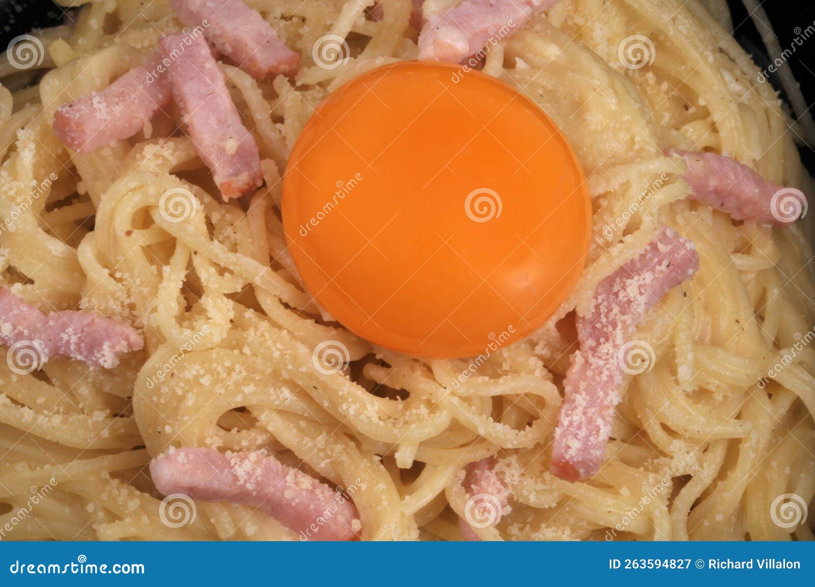 Plate Of Spaghetti Carbonara With An Egg Yolk Close Up Stock Image