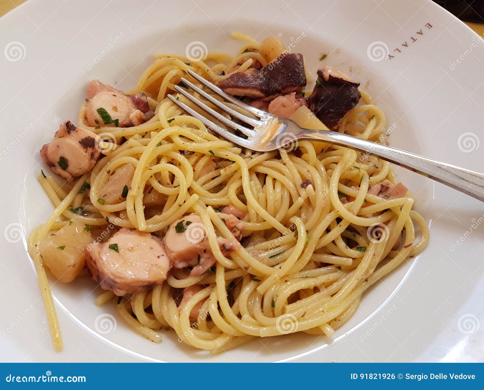 A Plate of Spaghetti with Octopus Fish Editorial Photo - Image of black ...