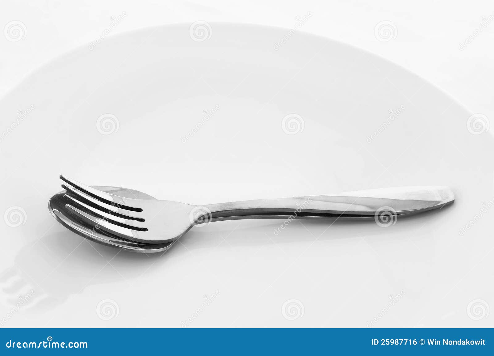 Plate with spoon and fork stock photo. Image of spoon - 25987716