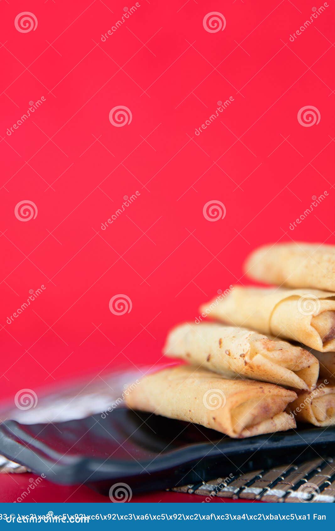 A Plate of Spring Rolls on the Red Background Stock Image - Image of ...