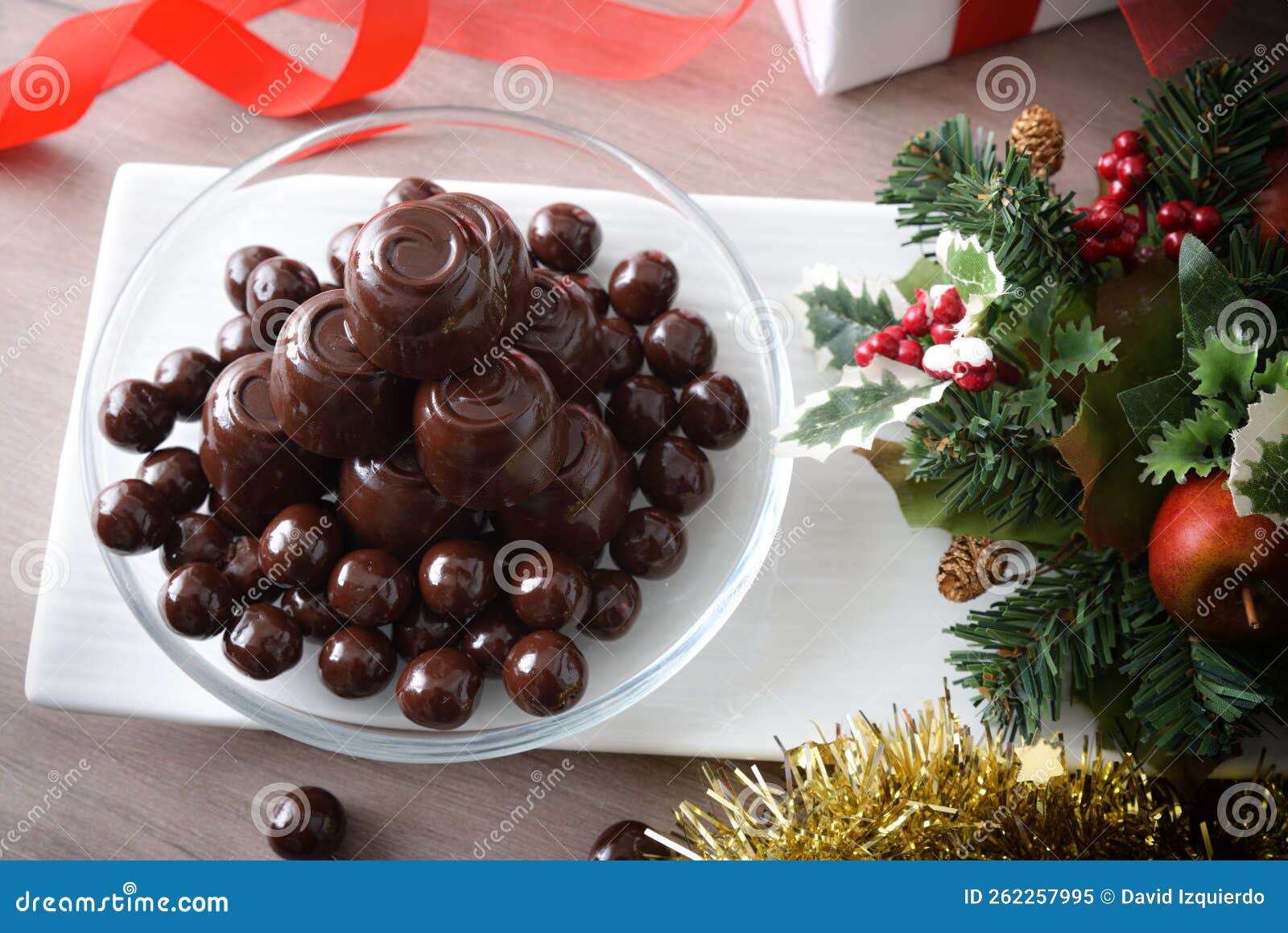 Plate with Stack of Chocolates and Dark Chocolate Balls Elevated Stock ...