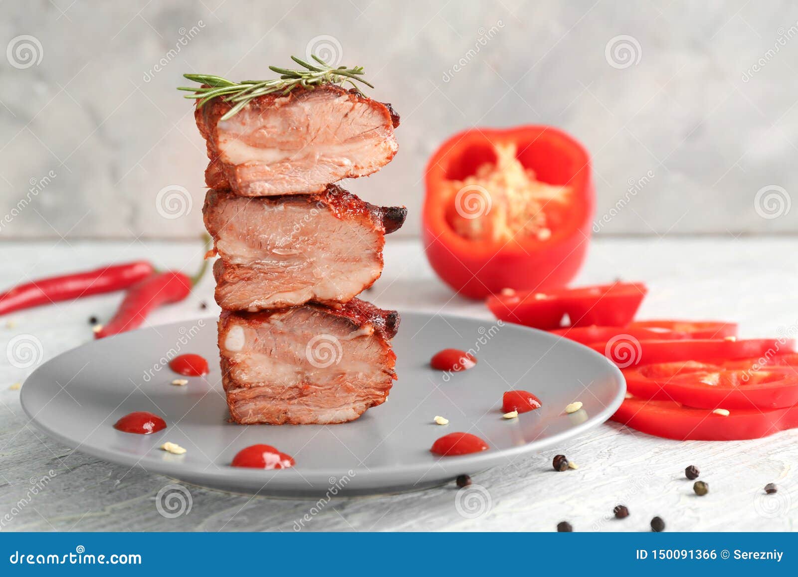 Plate with Stack of Delicious Grilled Ribs on Table Stock Photo - Image ...
