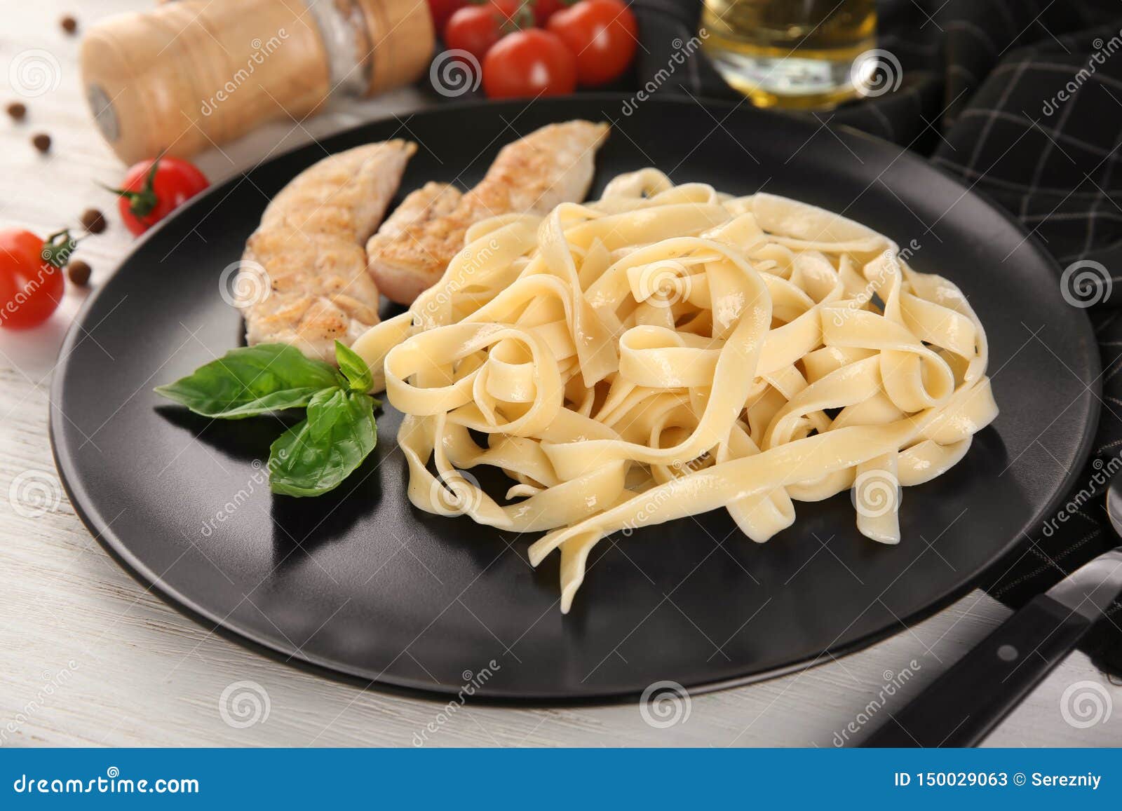 Plate of Tasty Pasta with Chicken Fillet on Table Stock Image - Image ...