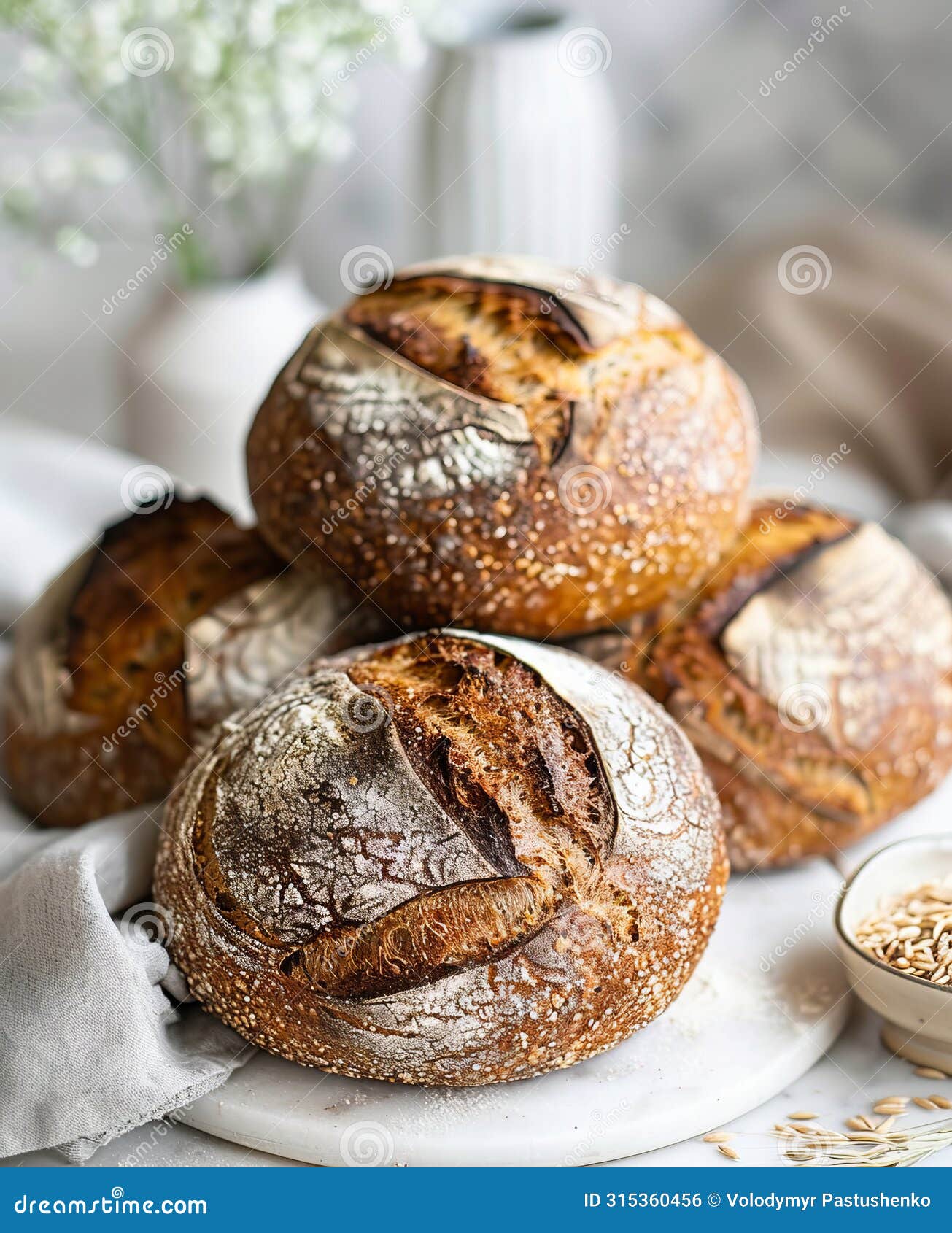 A Plate with Three Loaves of Bread on it Stock Photo - Image of cloth ...