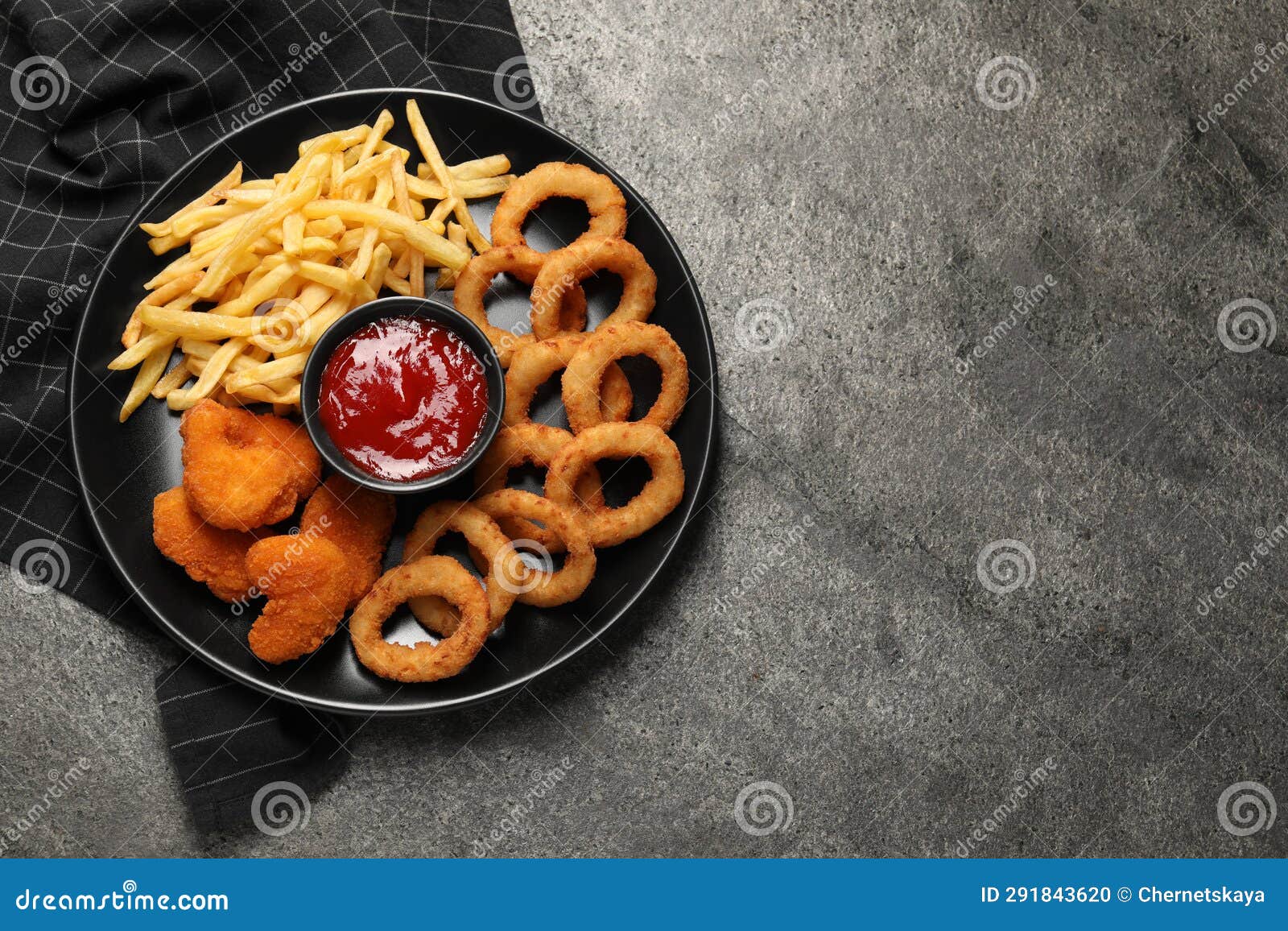 Plate with Tomato Ketchup and Different Snacks on Grey Textured Table ...