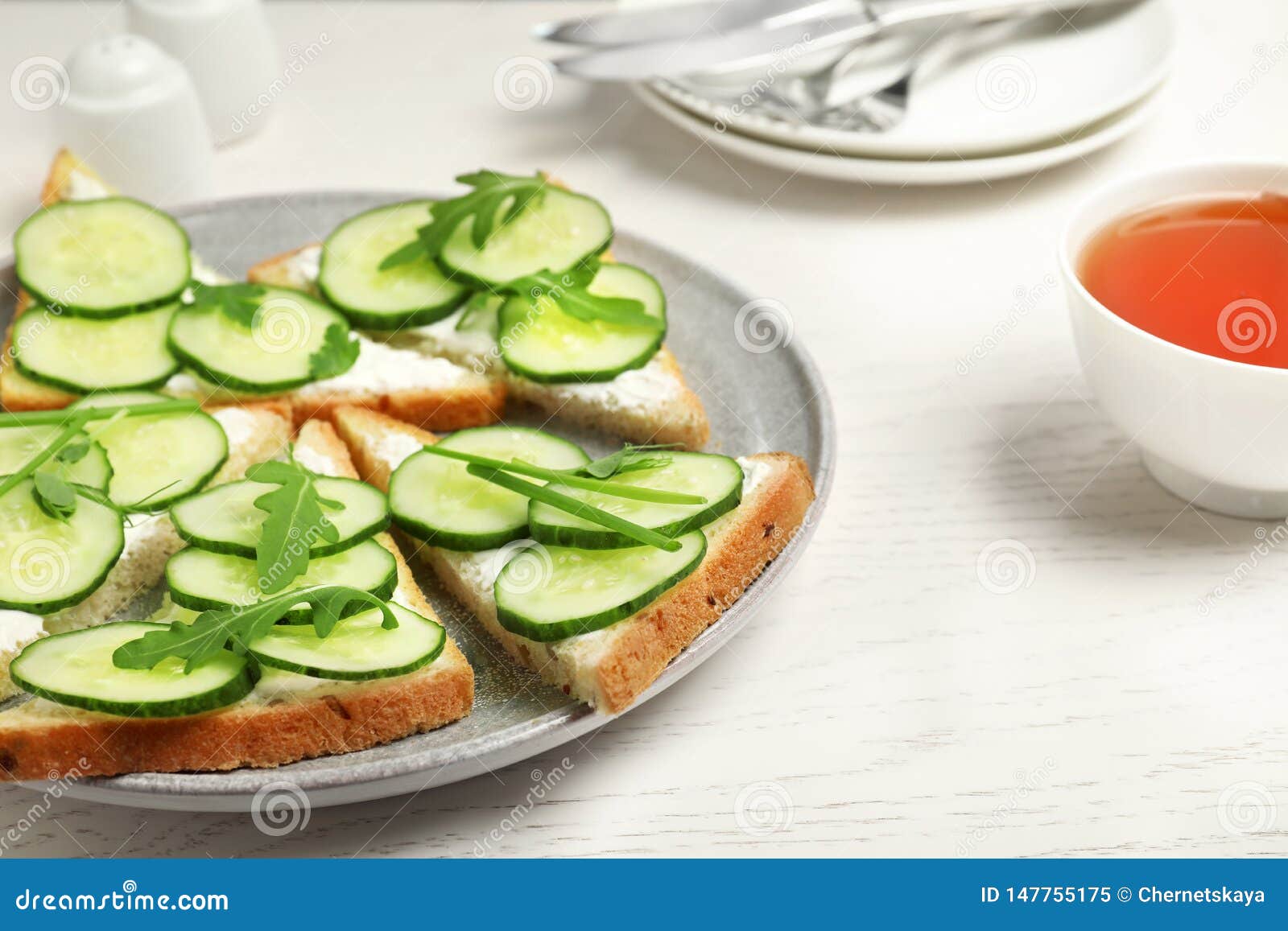 Plate with Traditional English Cucumber Sandwiches and Cup of Tea Stock ...