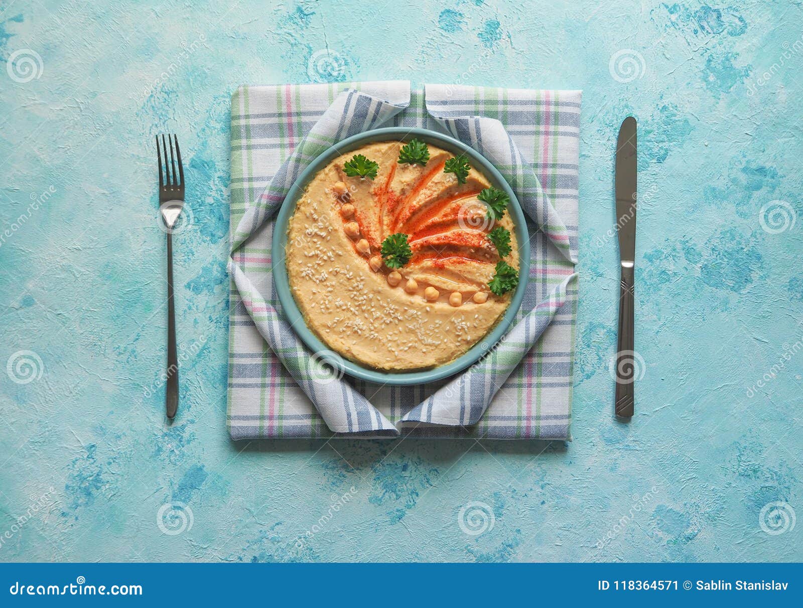 Plate with Traditional Hummus on a Blue Table. Stock Image - Image of ...