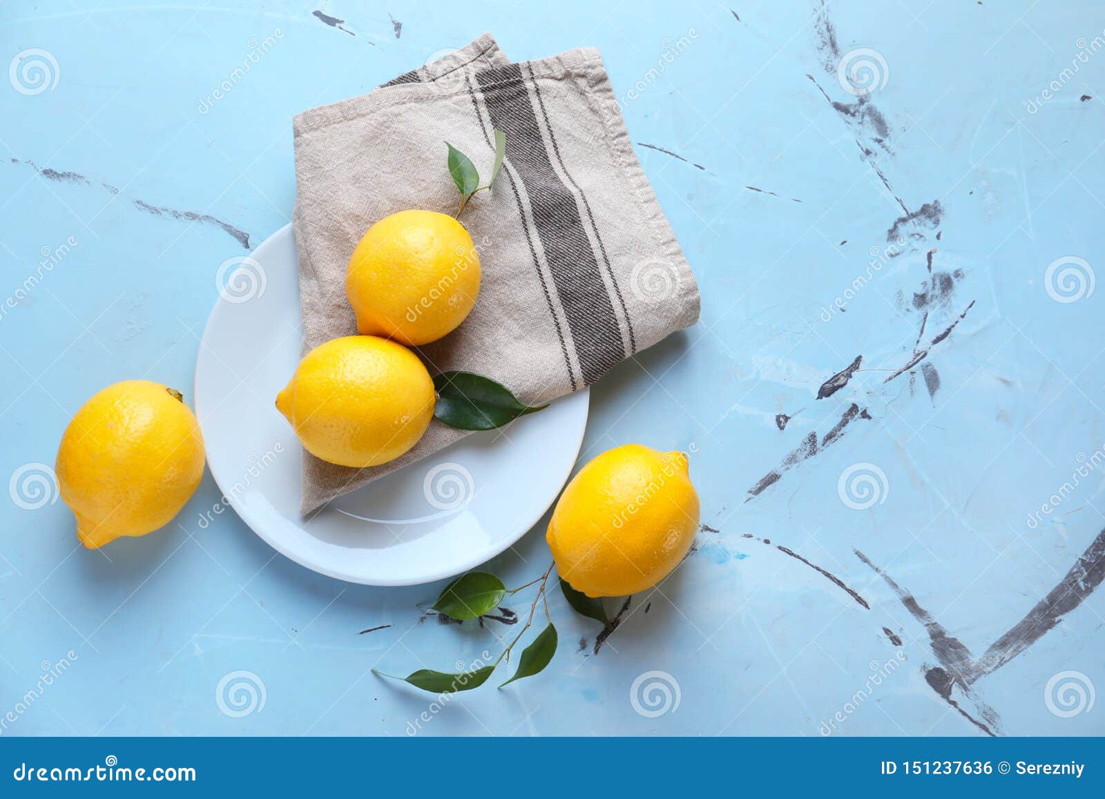 Plate with Whole Ripe Lemons on Light Table Stock Photo - Image of copy ...