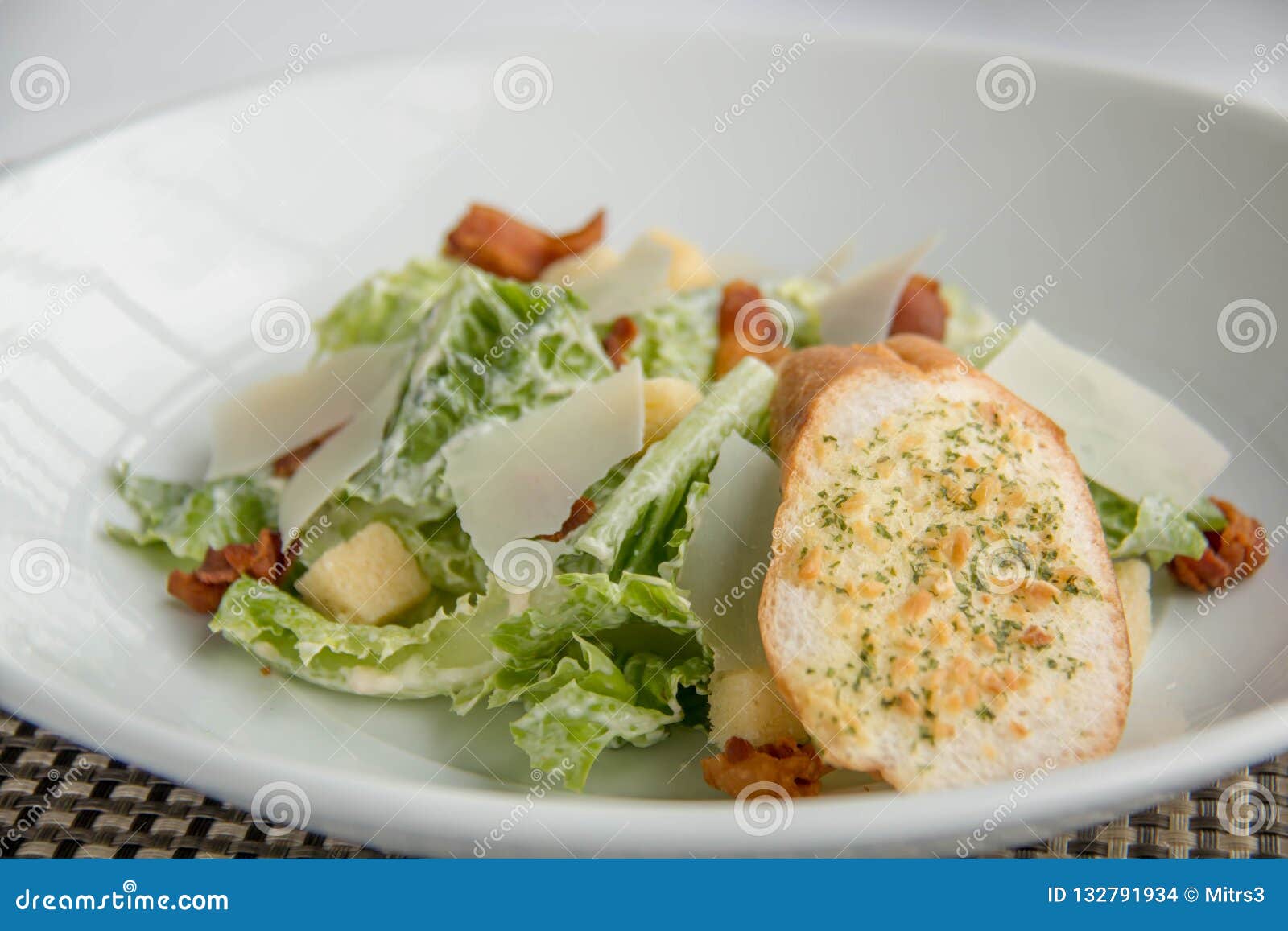 Plated Caesar Salad with Garlic Bread Stock Photo - Image of sauce ...