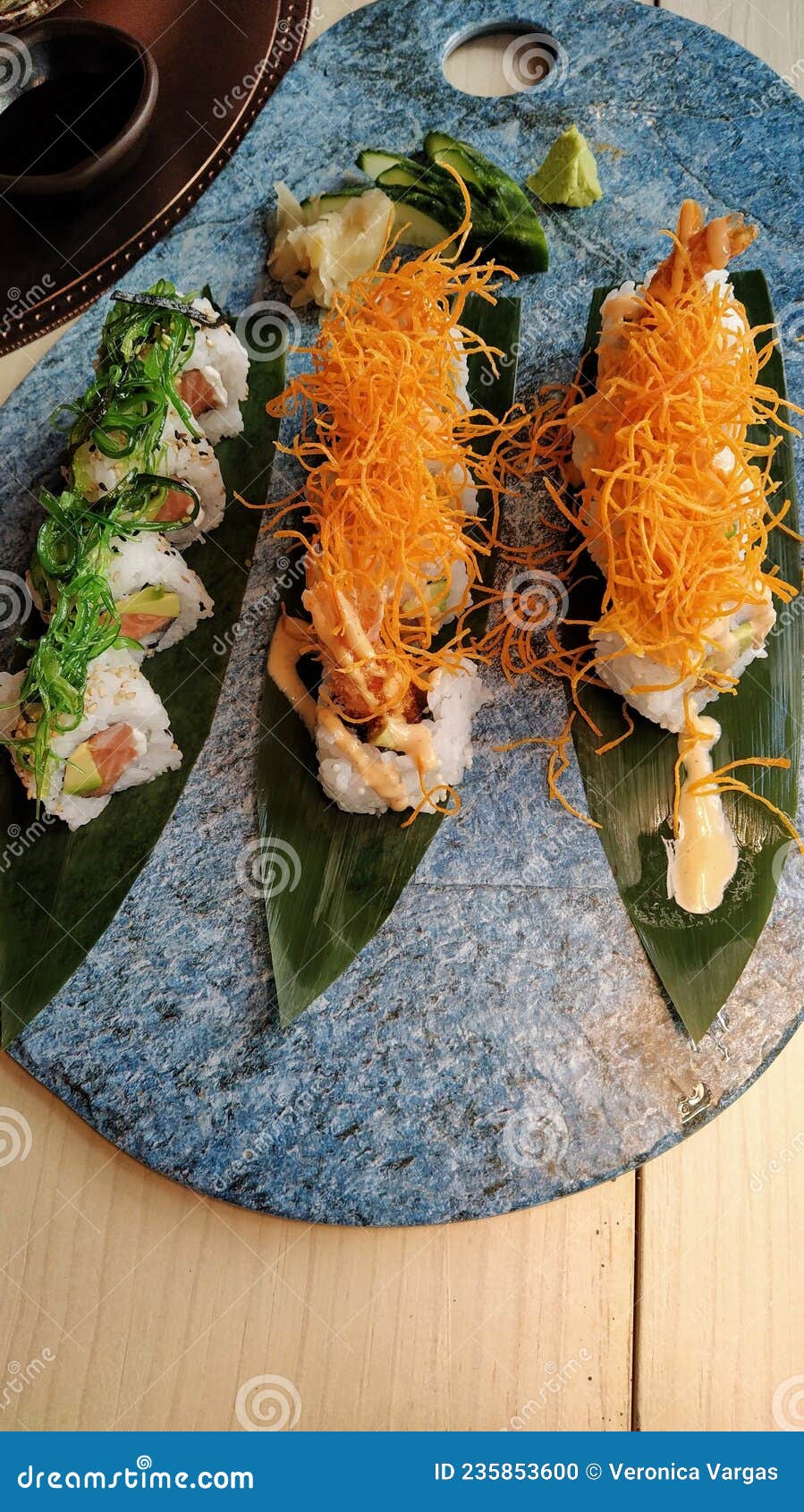 Plated with 3 Rows of Sushi Stock Photo - Image of long, green: 235853600