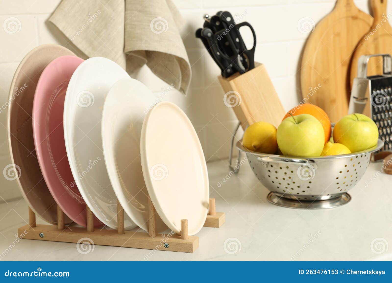 Plates, Different Cooking Utensils and Fruits on Kitchen Counter Stock ...
