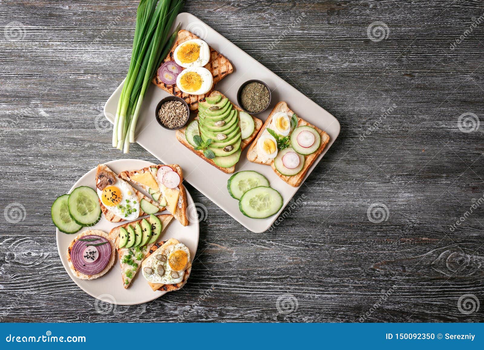 Plates with Different Delicious Toasts on Table Stock Photo - Image of ...