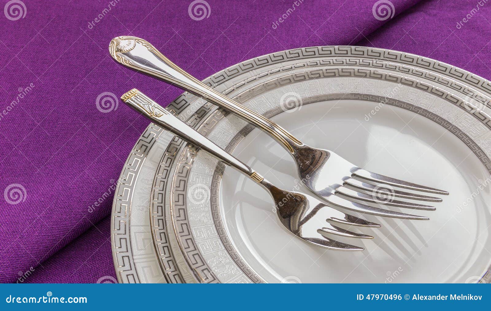 Plates and Forks on the Table Stock Photo - Image of colors, elegance ...