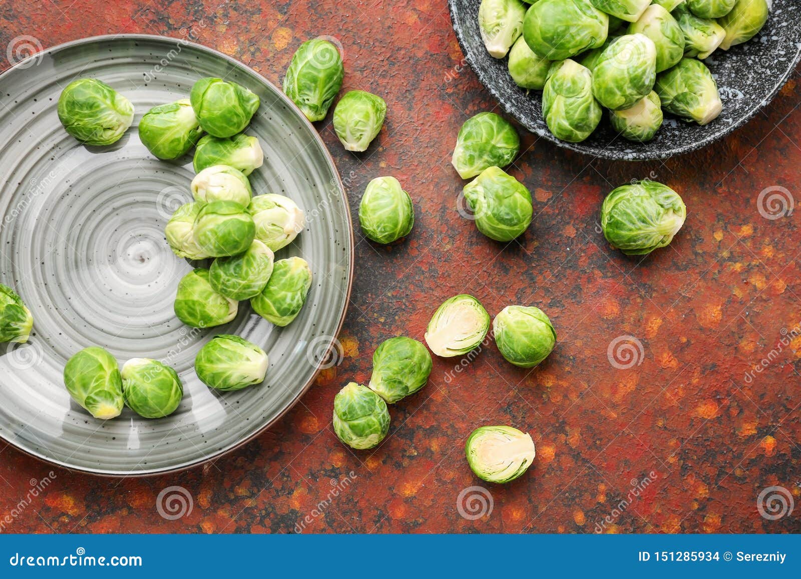 Plates with Fresh Brussels Sprouts on Table, Top View Stock Photo ...