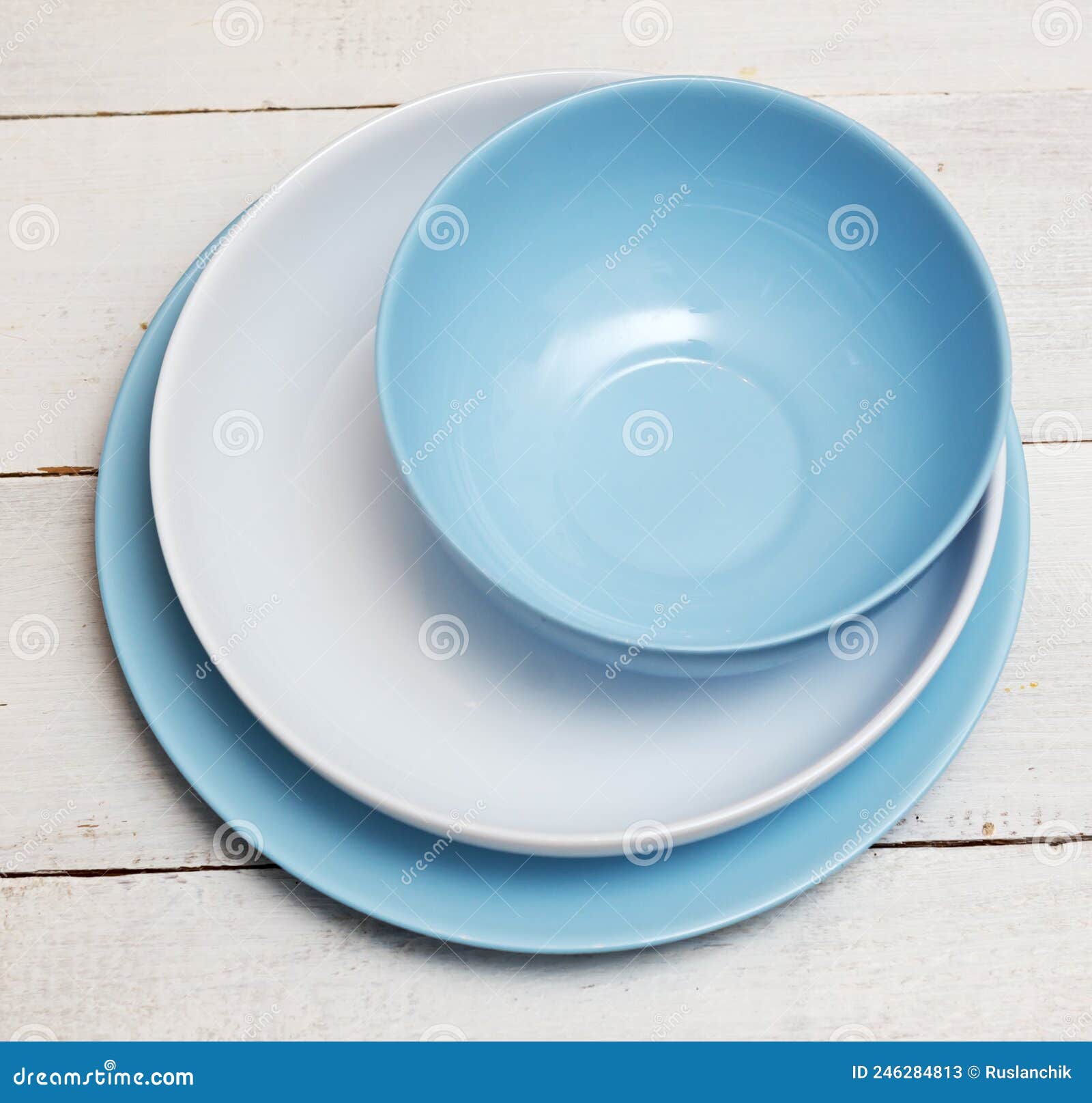 Plates on table stock image. Image of cookware, plate - 246284813