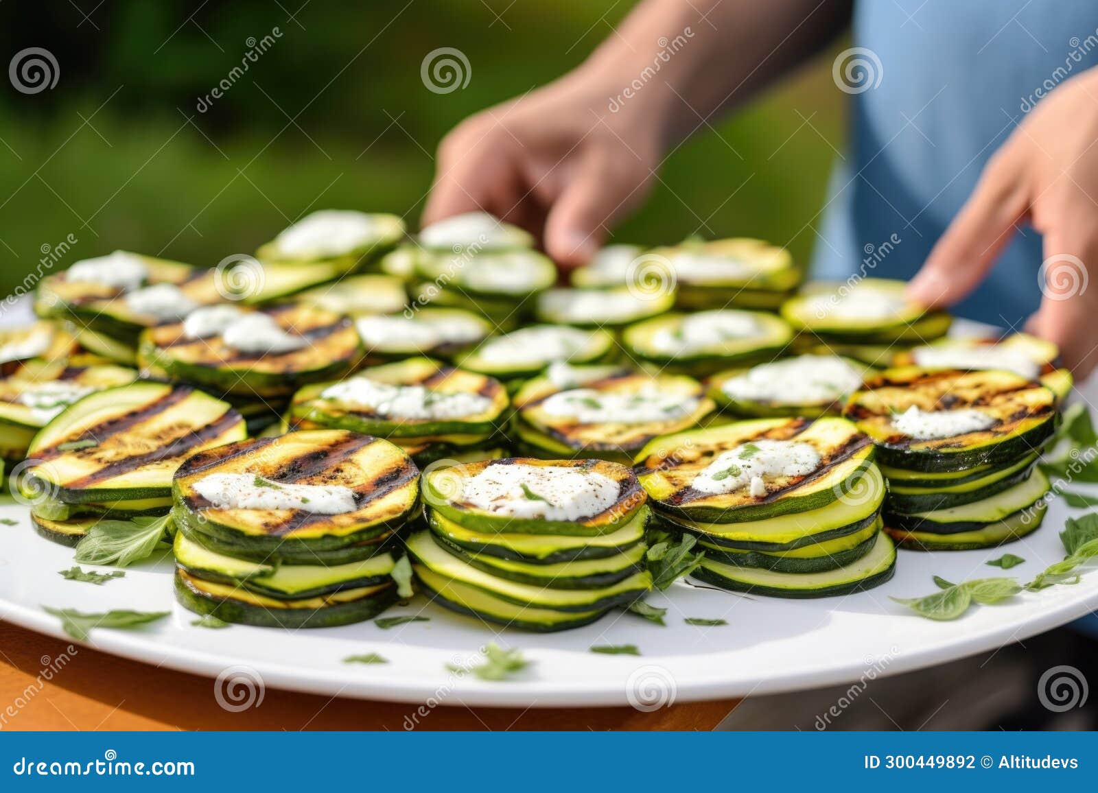 Plating Grilled Zucchini Slices for a Summer Salad Stock Photo - Image ...