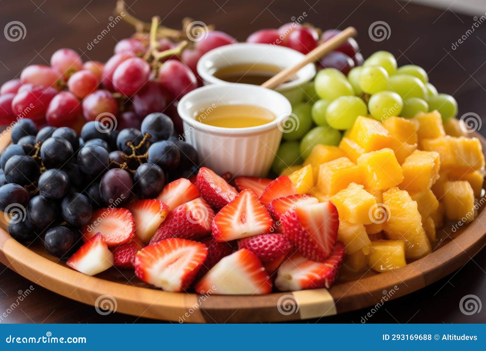 A Platter of Bite-sized Fruit Pieces with a Little Honey Dip Stock ...