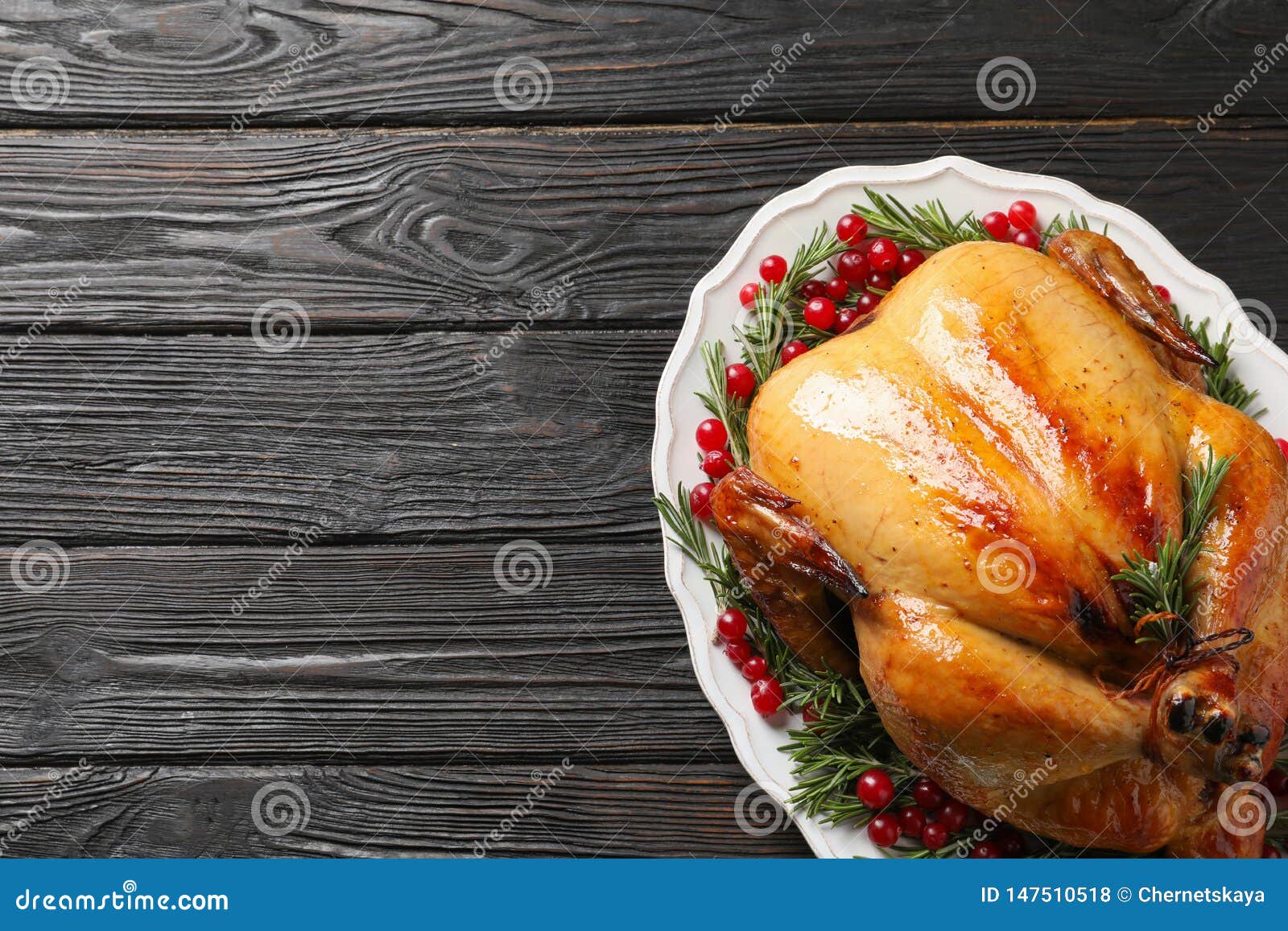 Platter of Cooked Turkey with Garnish on Wooden Background, Top View ...