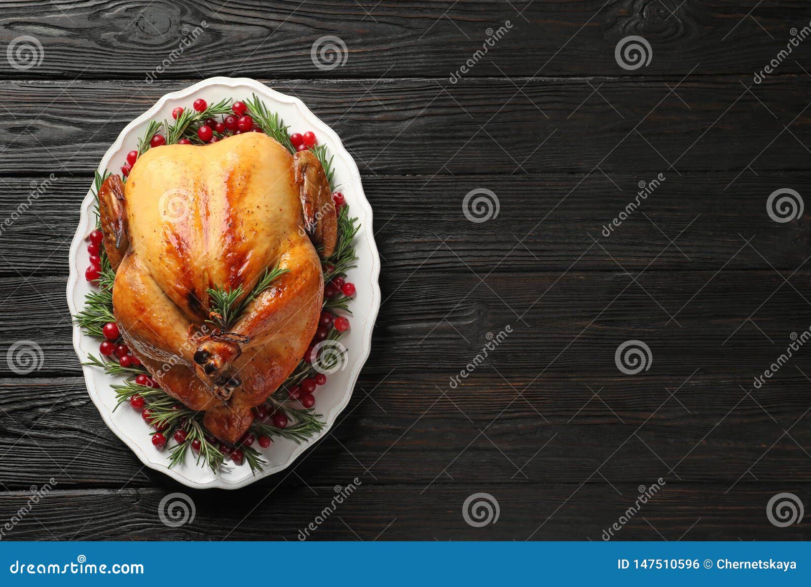 Platter of Cooked Turkey with Garnish on Wooden Background, Top View ...