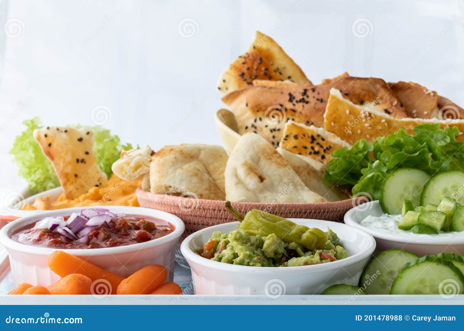 A Platter Full of Various Dips with Crisp Breads and Vegetables for ...